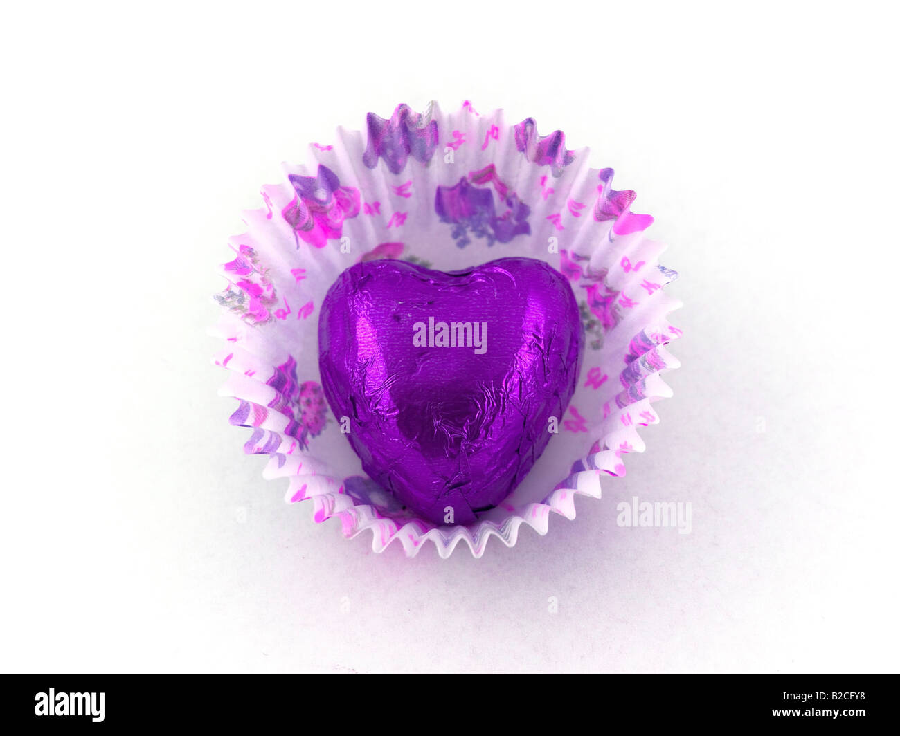 Purple Heart Chocolate in Paper Cake Case Stock Photo - Alamy