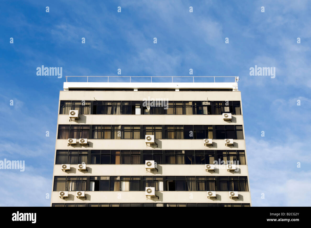 Drab boring old building with air conditioning units in windows Stock ...