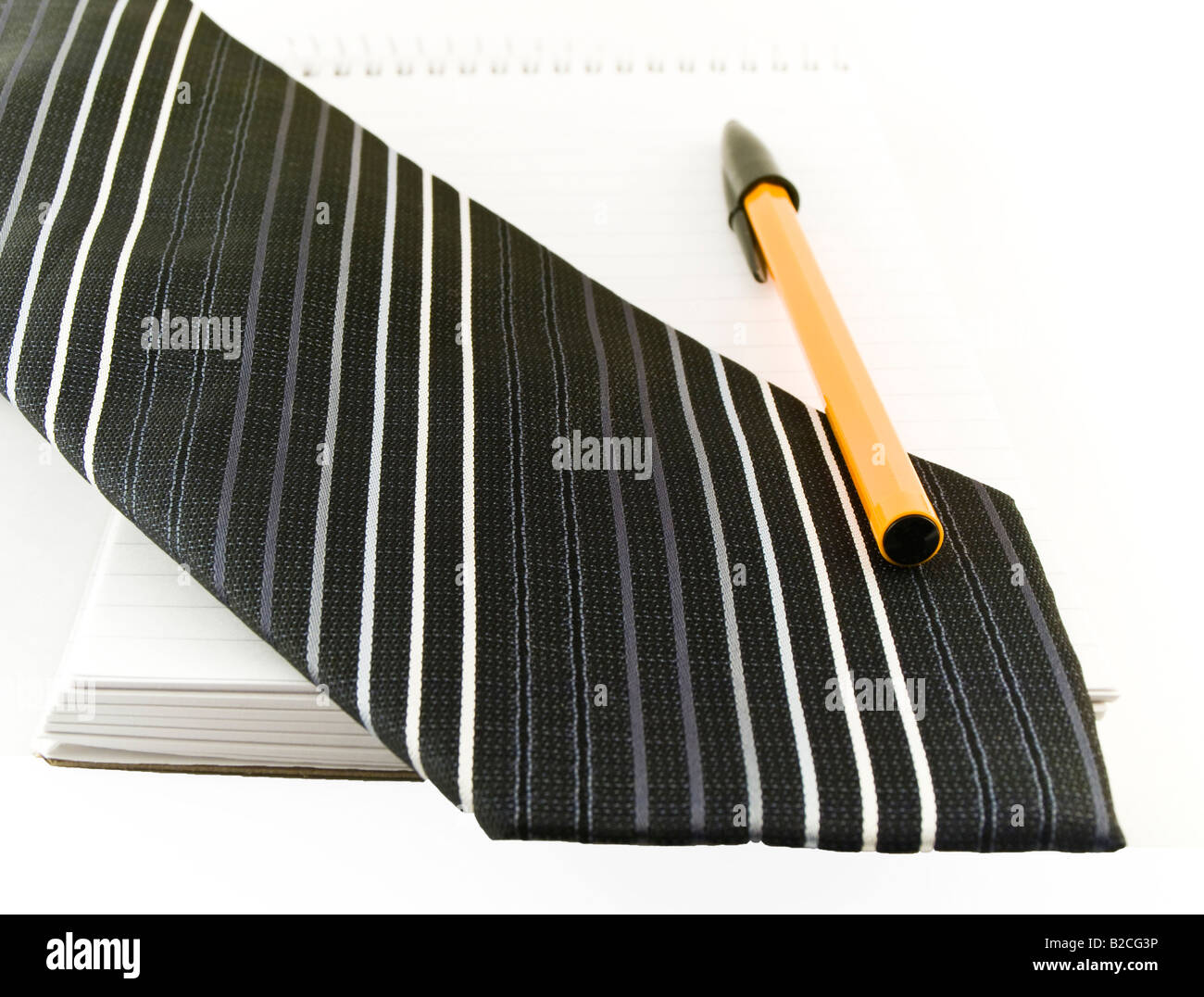 Ballpoint Pen and Tie on Notepad on White Background Stock Photo - Alamy