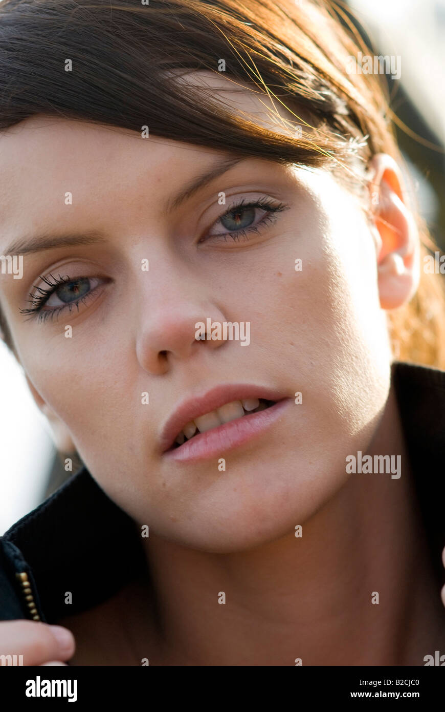 portrait of a young woman in sidelight Stock Photo - Alamy