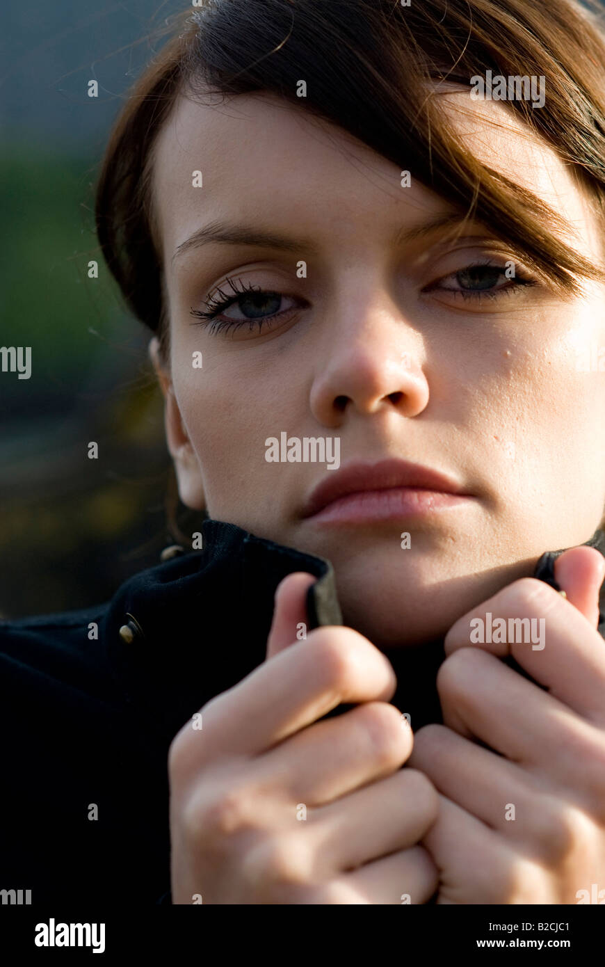 portrait of a young woman in sidelight Stock Photo - Alamy