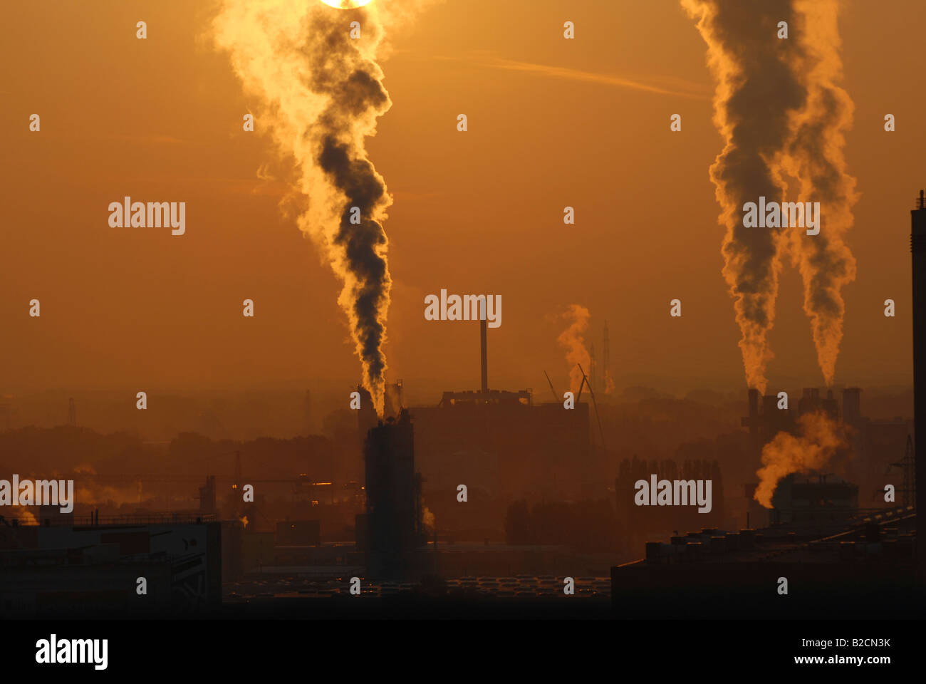chimney with factory fumes at sunset Stock Photo - Alamy