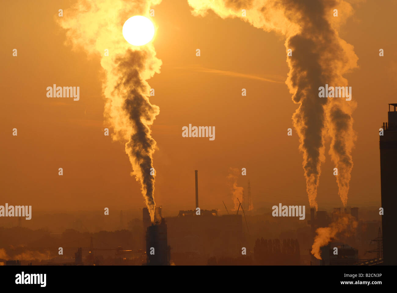 chimney with factory fumes at sunset Stock Photo - Alamy
