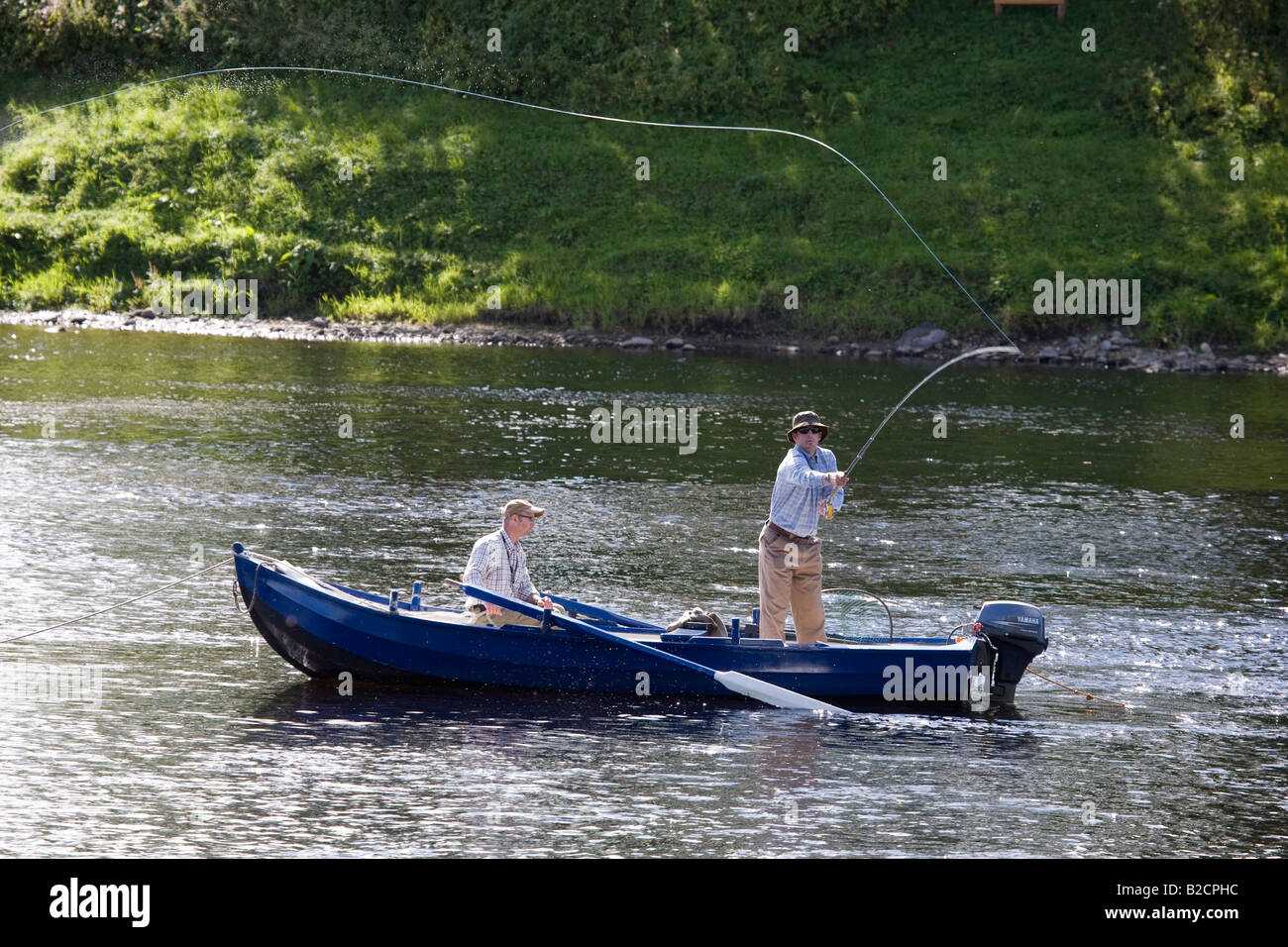 Vacations Two Men Fishing Rowing Boat High Resolution Stock Photography ...