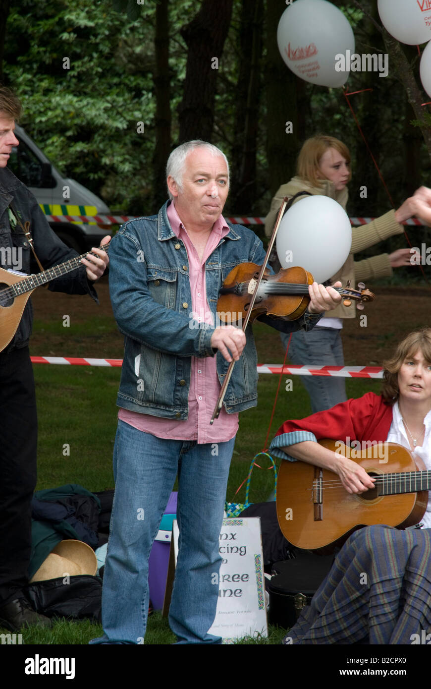 Fiddler playing for Manx dancing group Stock Photo - Alamy