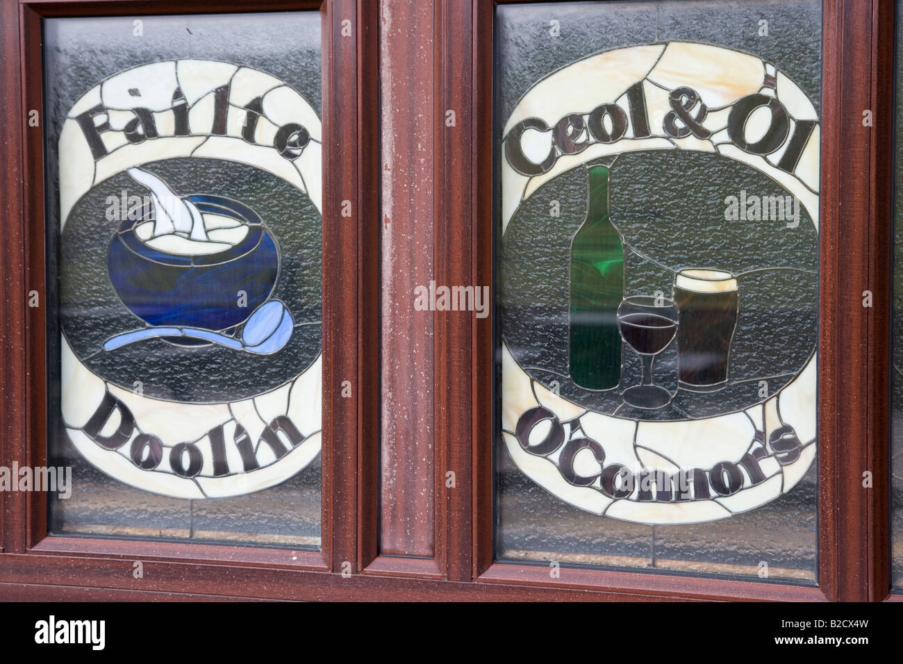 Stained glass signs on Irish pub window, Doolin County Clare, Ireland ...