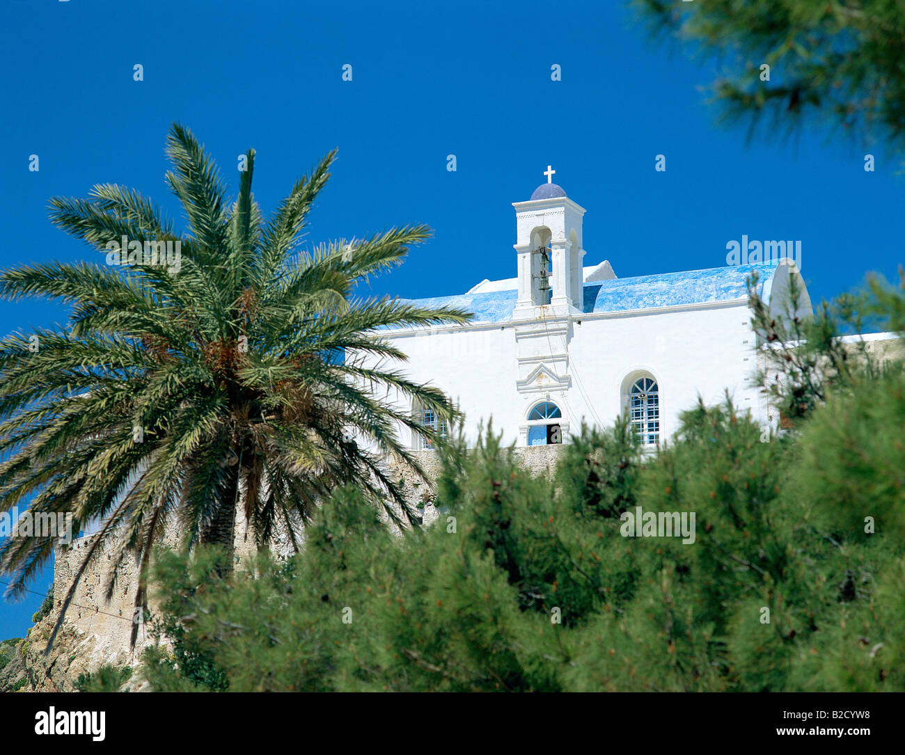 Monastery with palm tree in foreground Greek Islands, Crete Stock Photo ...