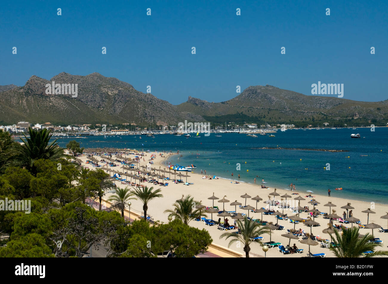 Port Pollenca Beach with Town and Tramuntana Mountains in background ...