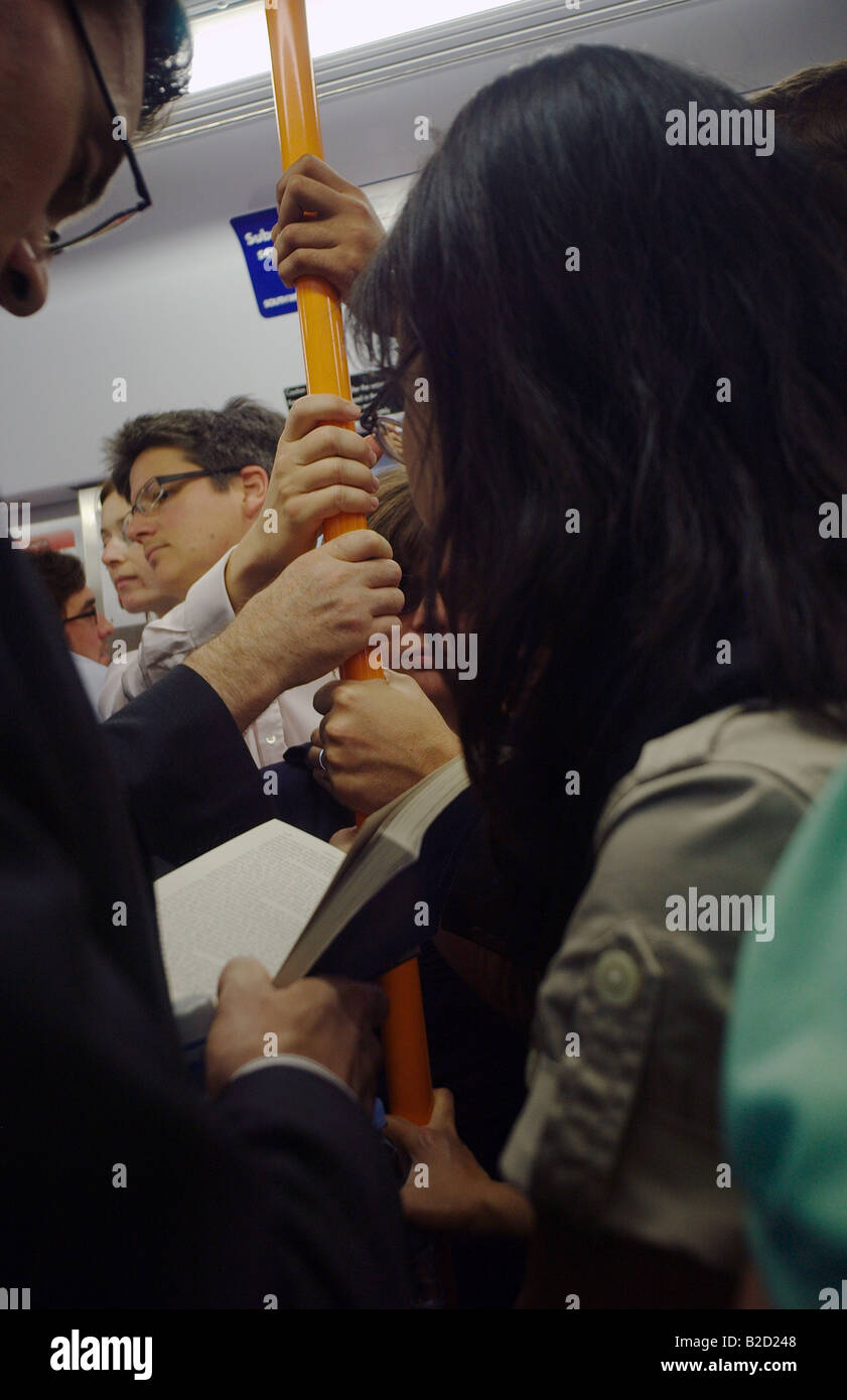 Passengers on a crowded commuter train carriage Stock Photo - Alamy