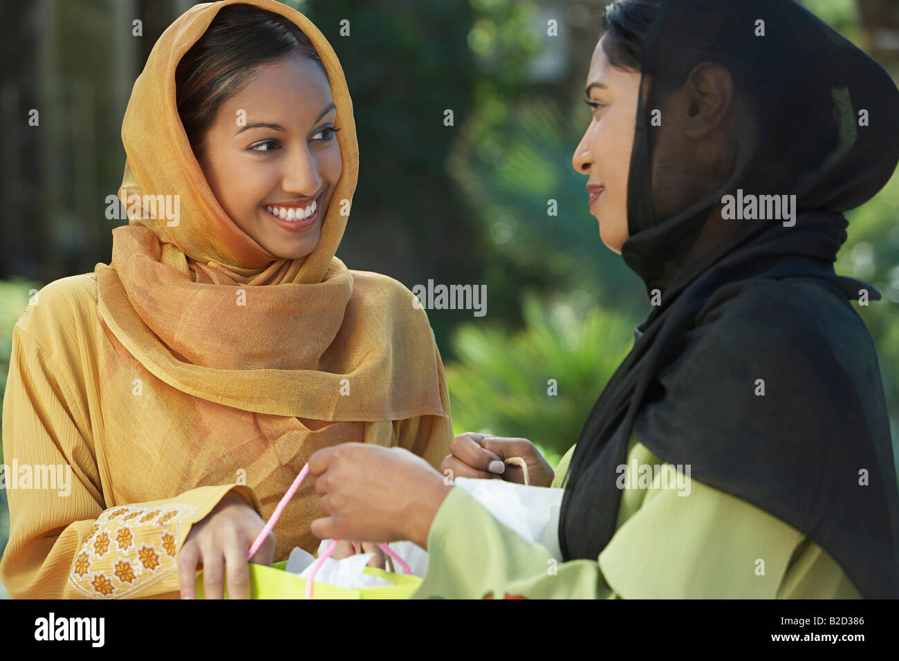 Two young muslim women talking outdoors Stock Photo - Alamy