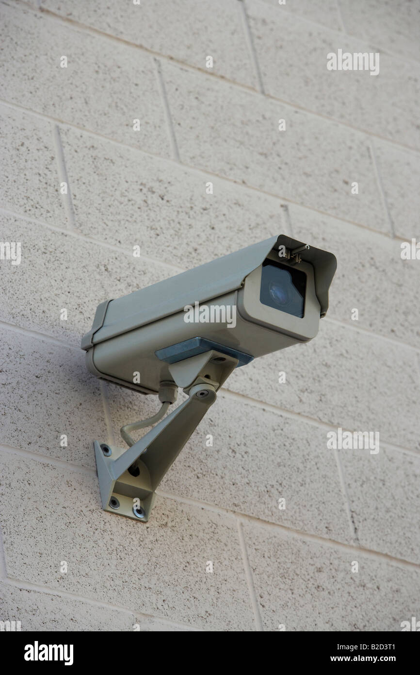 Security camera on wall Stock Photo - Alamy