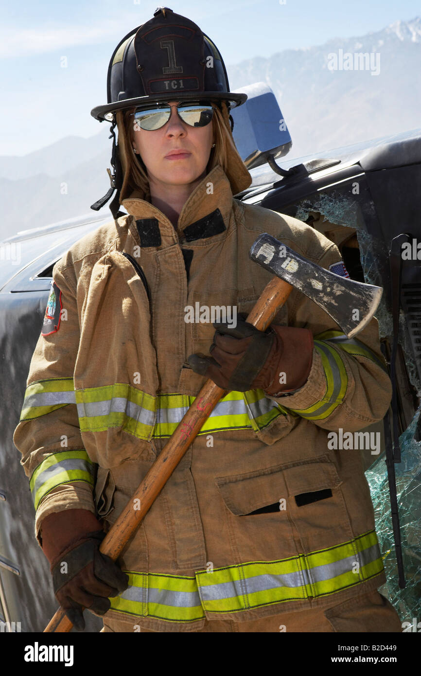 Firefighter holding axe hi-res stock photography and images - Alamy