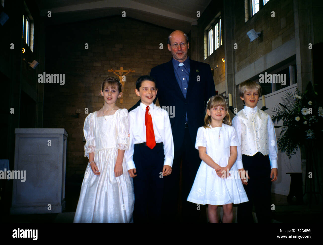 First communion children priest st hi-res stock photography and images ...