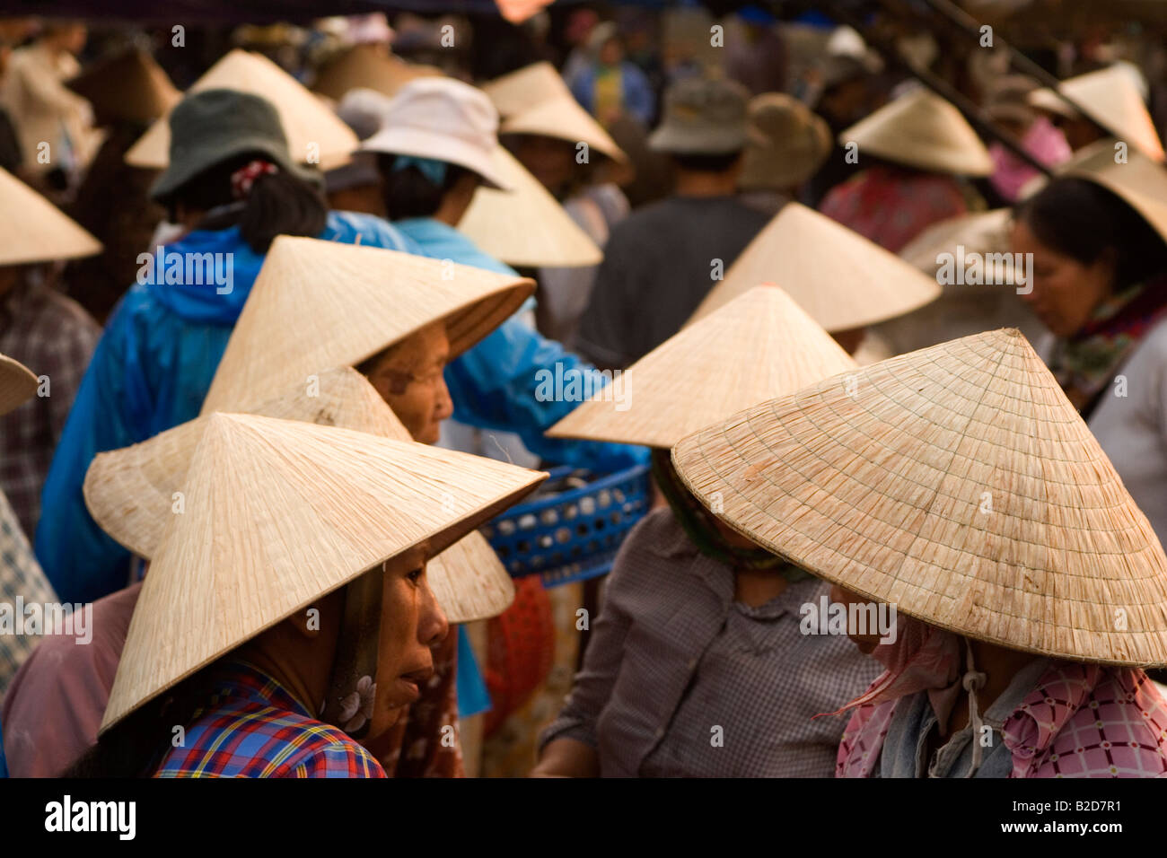 Vietnamese women stand on the fish quay in Hoi An in Vietnam Stock ...