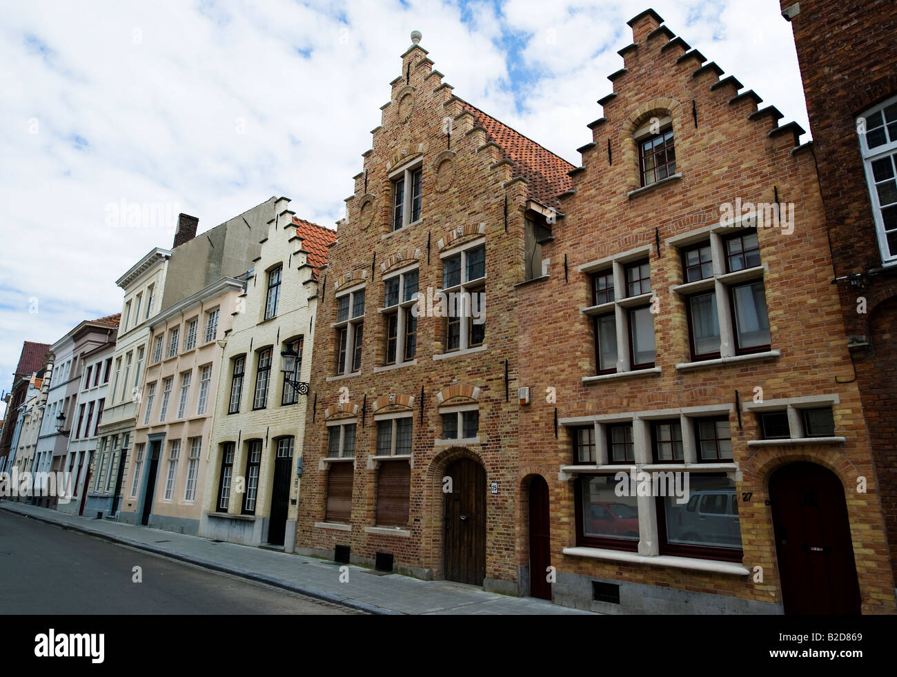 A street in Bruges with stepped gable houses Stock Photo - Alamy