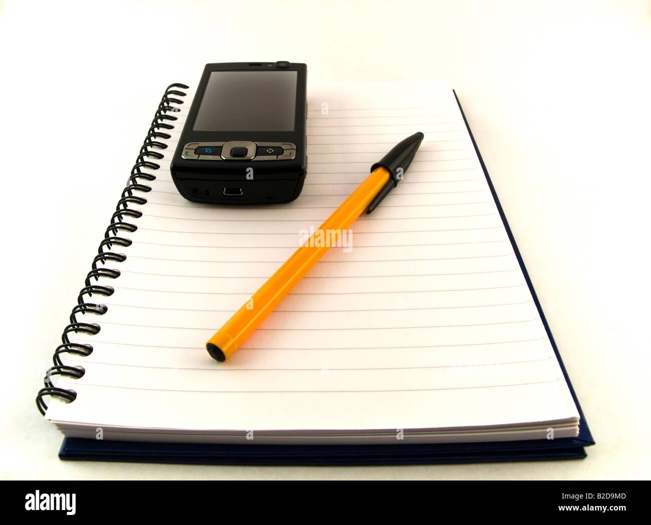 Ballpoint Pen and Mobile Phone on Notebook White Background Stock Photo ...