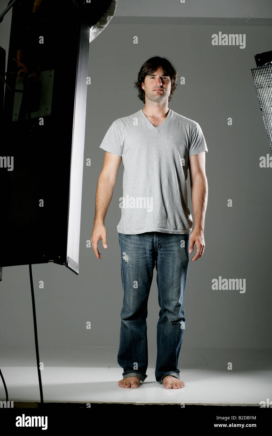 Young man posing in studio shot Stock Photo - Alamy