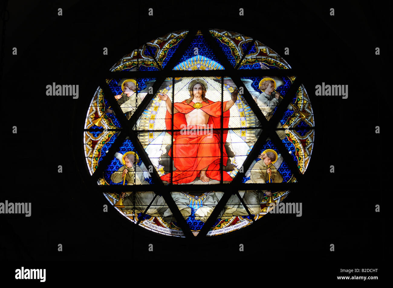 A painted-glass showing Jesus Christ in the middle of a David star in ...