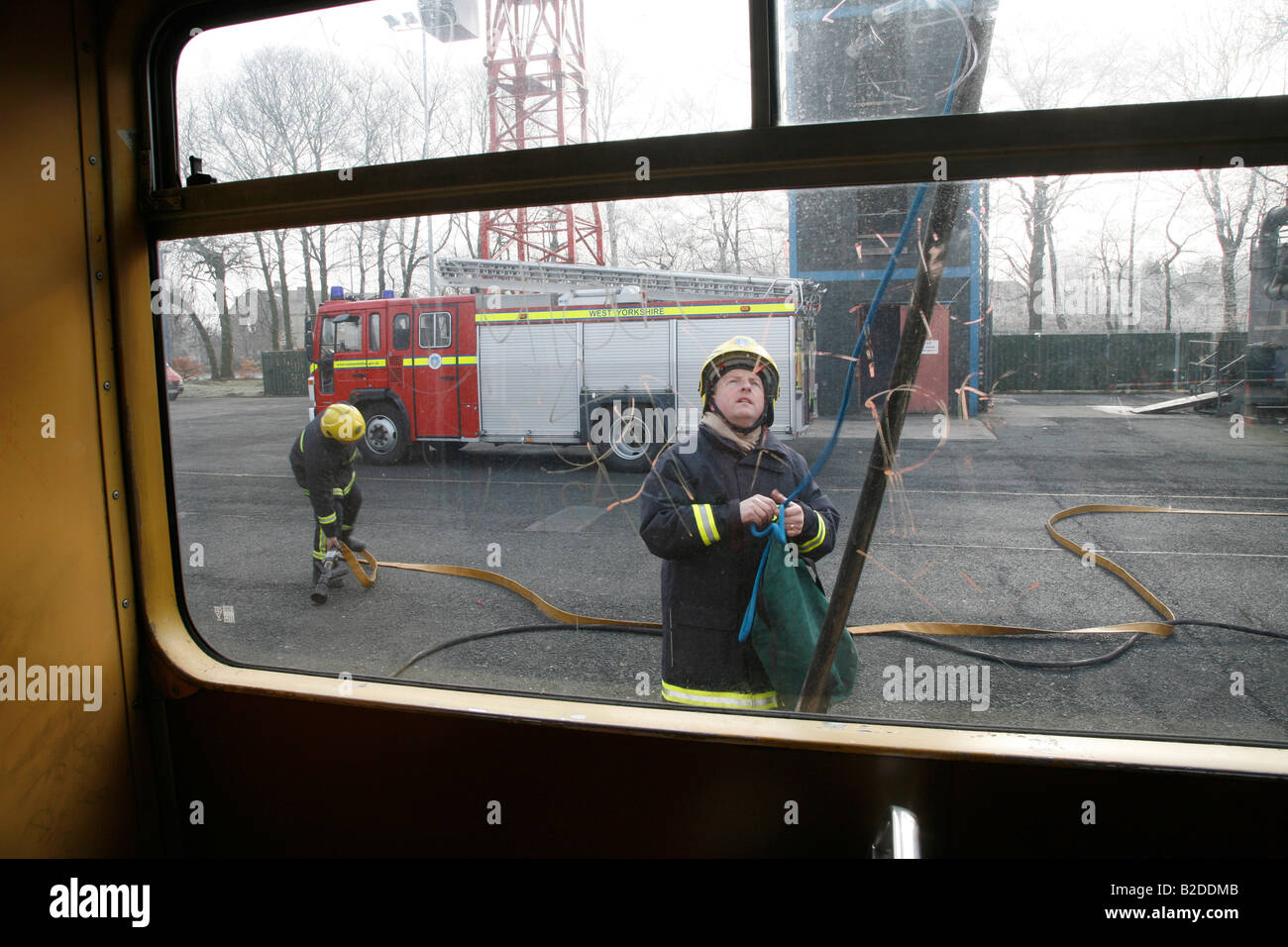 Firemen outside a fire damaged bus during a training exercise Stock ...