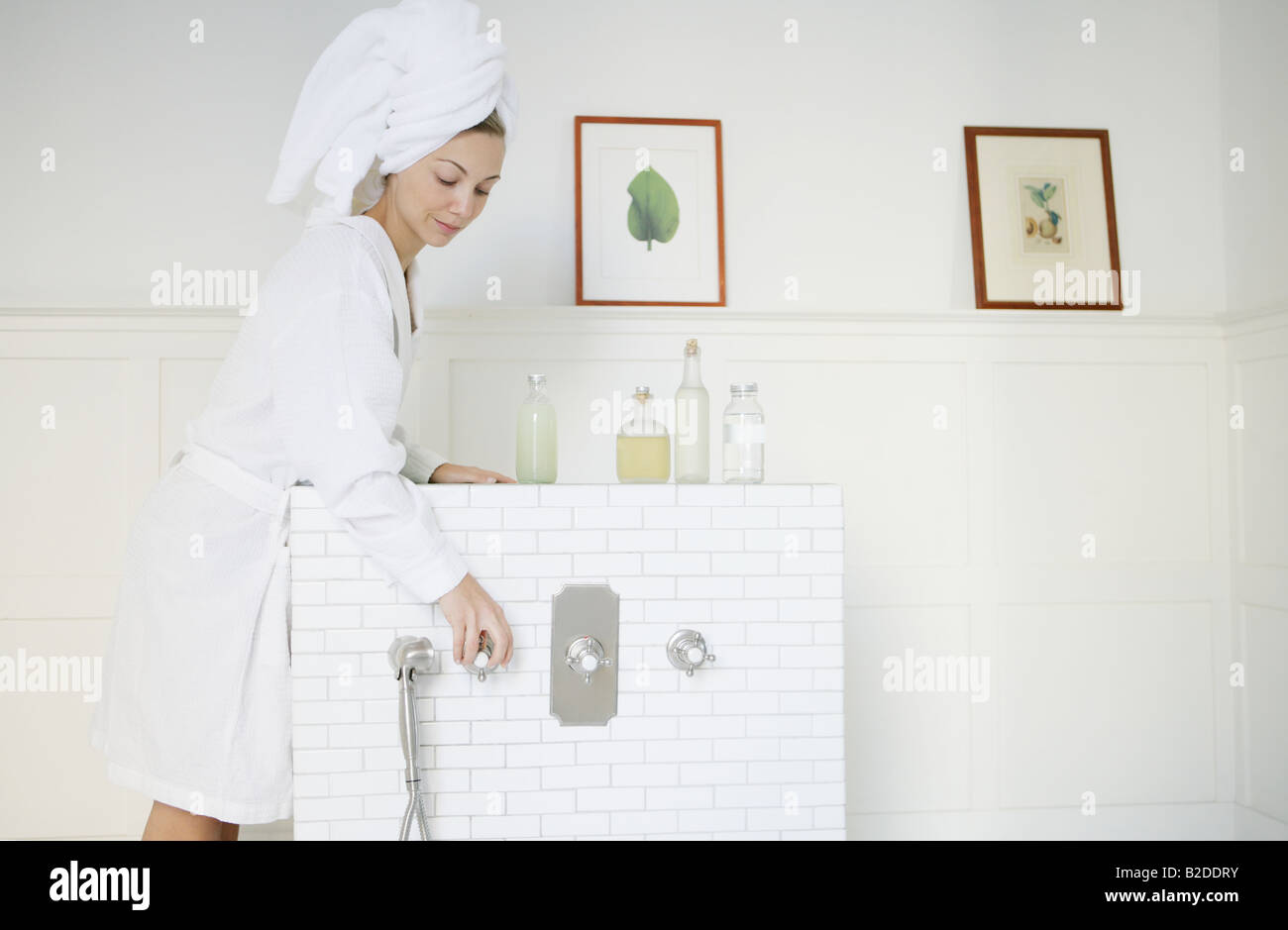 Young woman preparing bath Stock Photo - Alamy