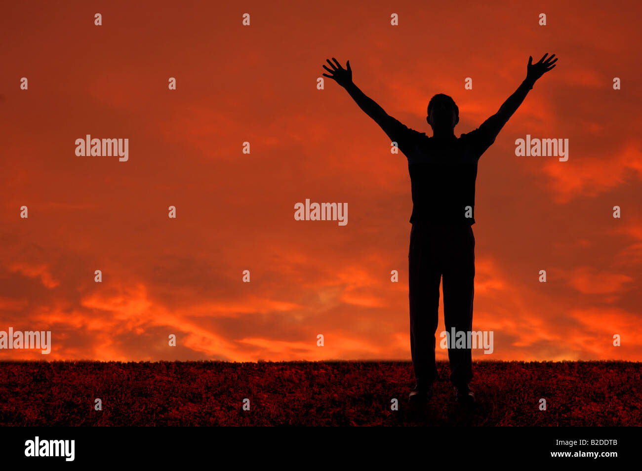 Man with arms extended toward heaven Stock Photo - Alamy