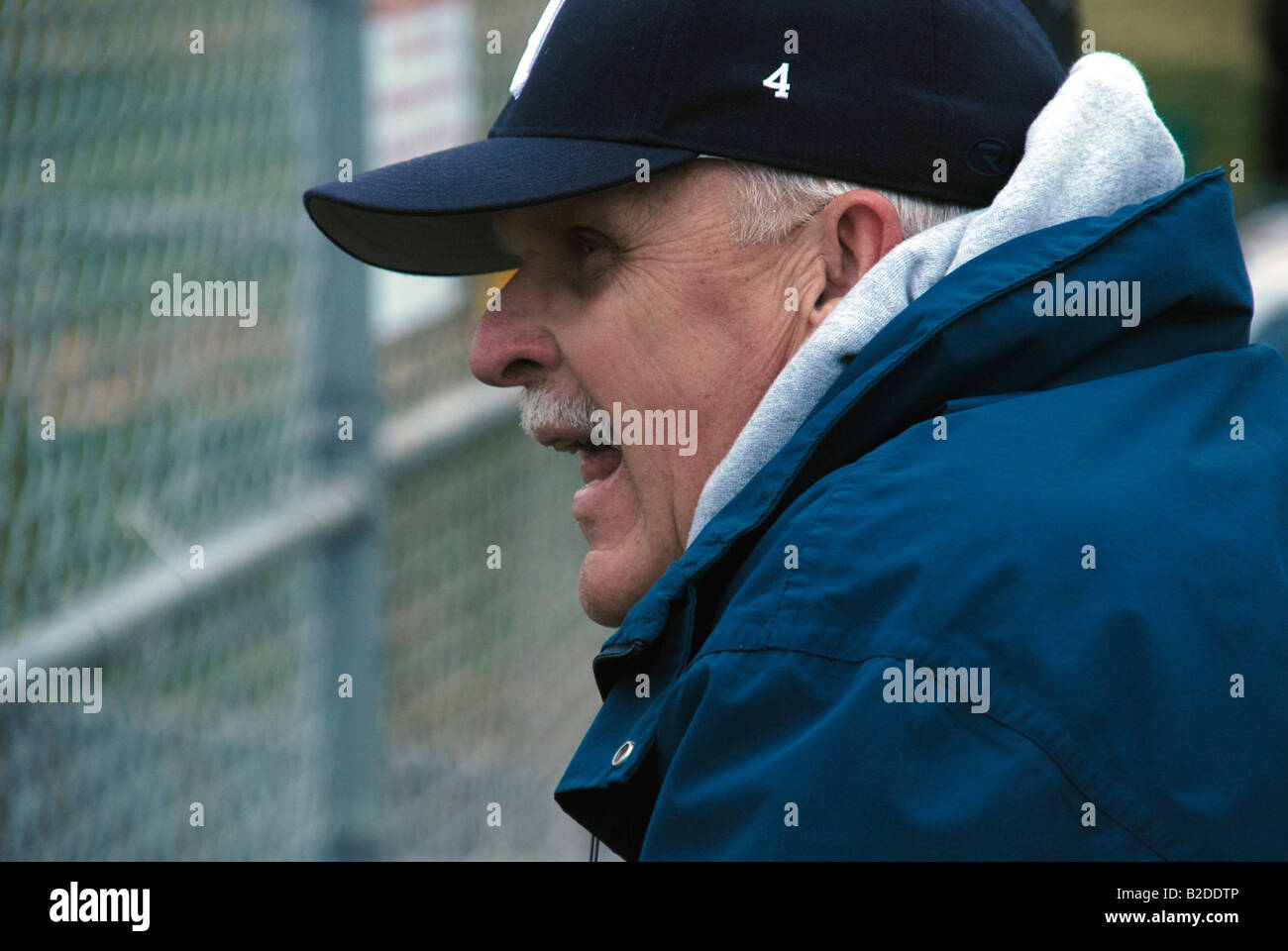 a coach yells at his team during a baseball game Stock Photo - Alamy