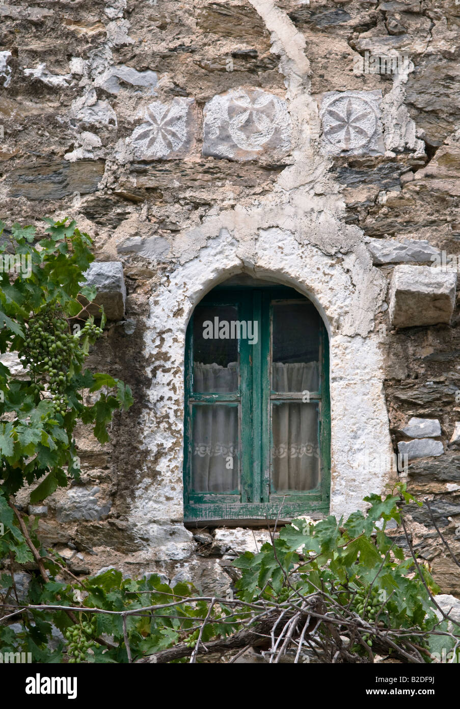 Window and carved detail on a traditional stone house in the Maniot ...