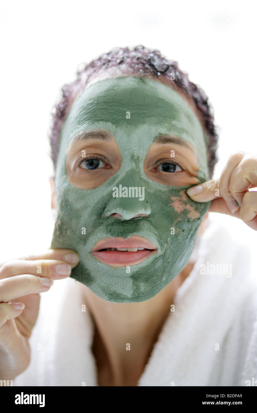 Woman peeling off mask hi-res stock photography and images - Alamy