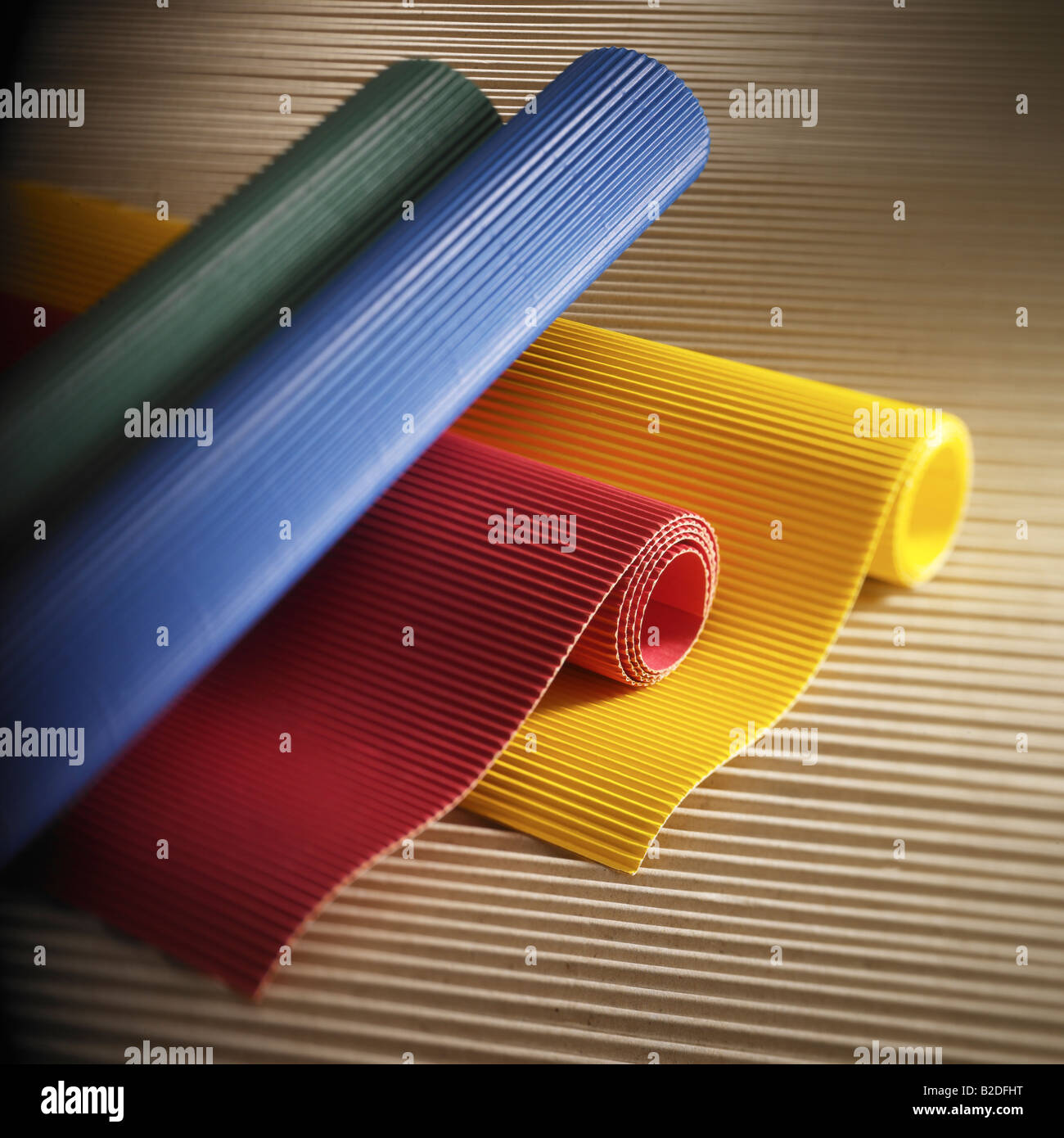 Coloured rolls of corrugated paper Stock Photo - Alamy