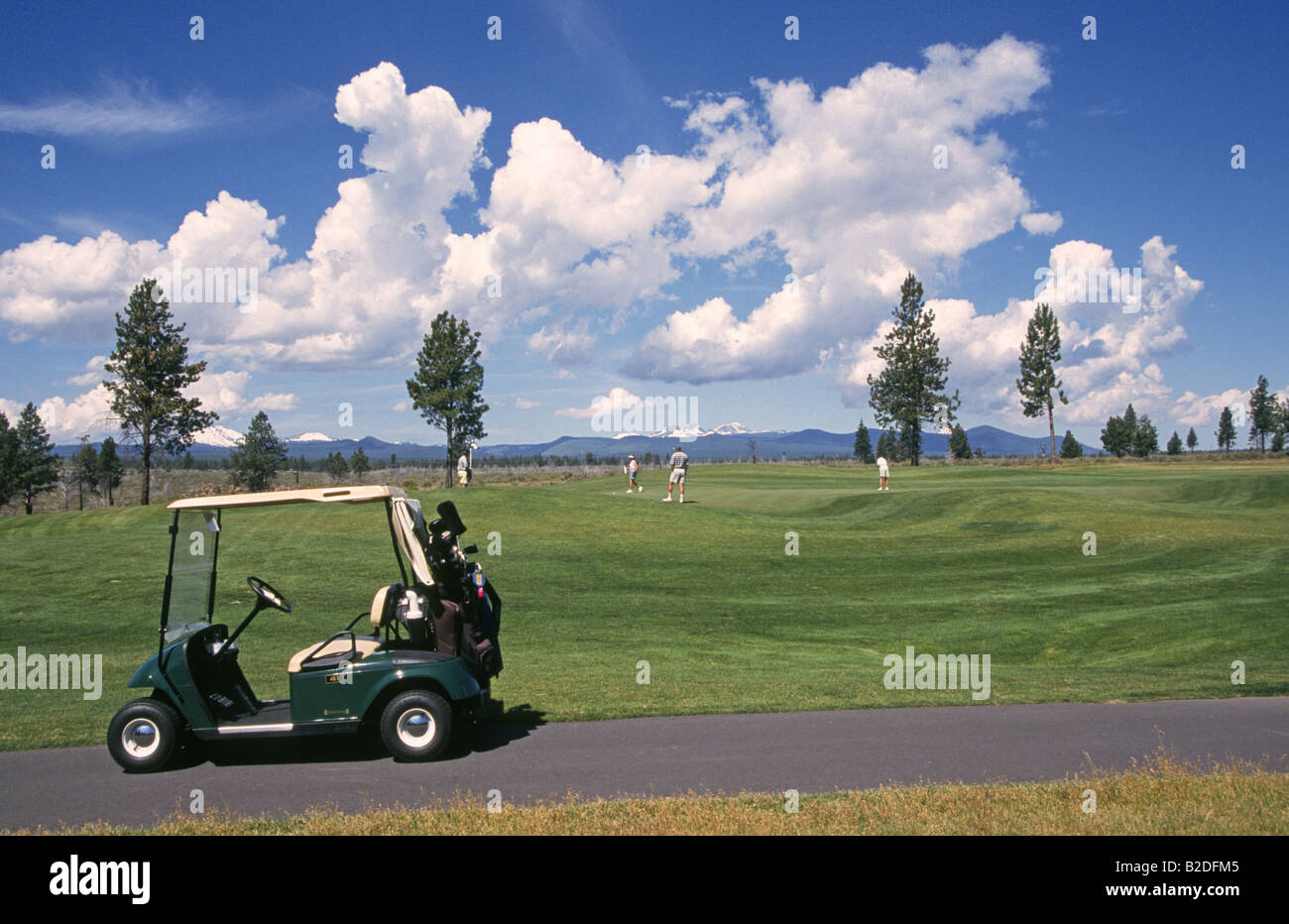 A golfer tees off at one of Bend Oregon s numerous golf courses on the ...