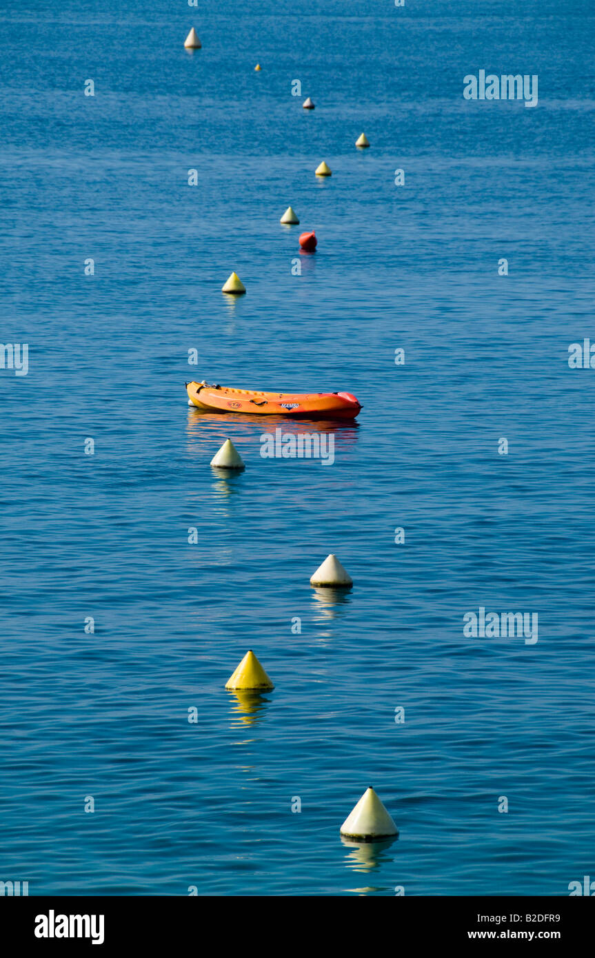 an orange boat floating in the sea, Anges Bay, Nice, Cote d'Azur ...