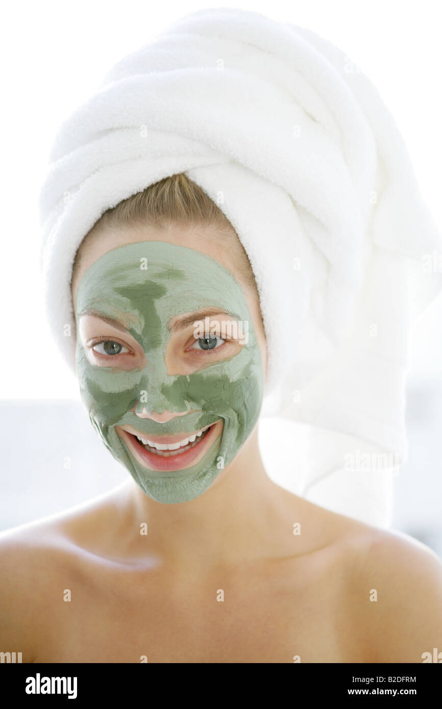 Happy young woman wearing facial mask Stock Photo - Alamy