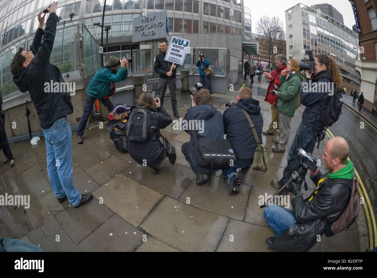 Photographers picture NUJ Gen Secretary Jeremy Dear holding poster ...