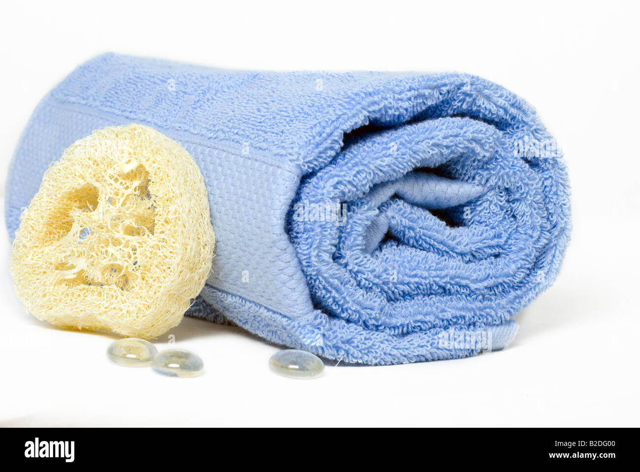 Towel with a sponge on a light background Stock Photo - Alamy