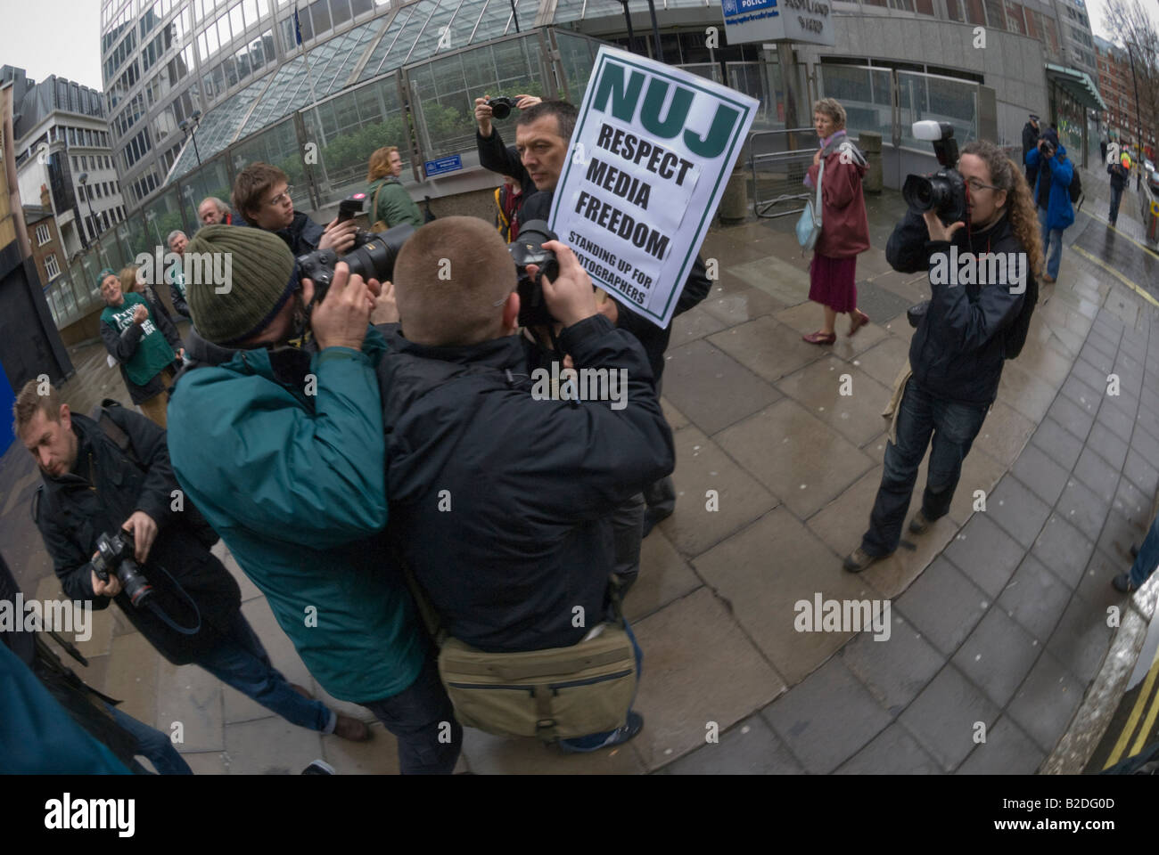 Photographers picture NUJ Gen Secretary Jeremy Dear holding poster ...