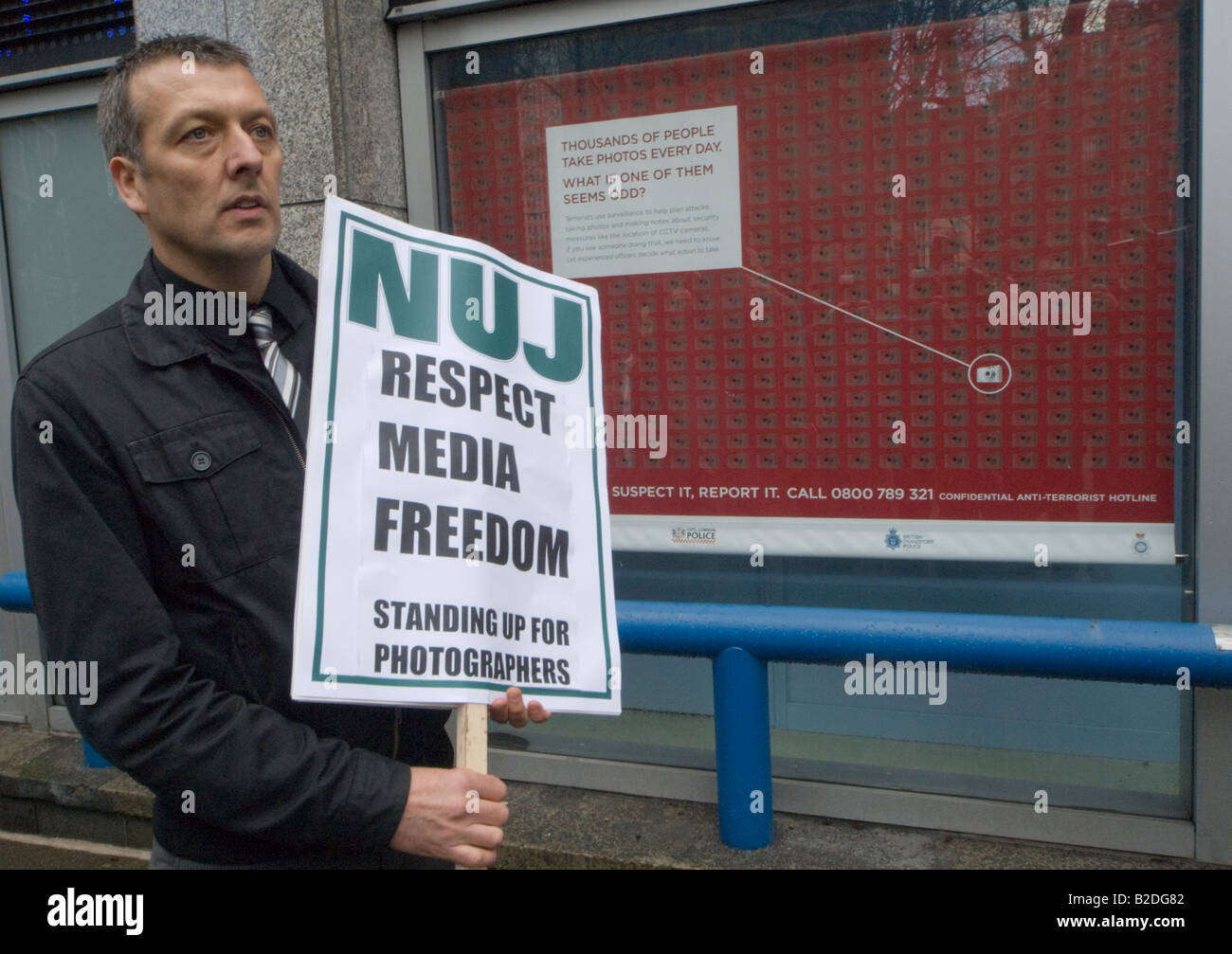 NUJ Gen Secretary Jeremy Dear poses beside police anti-photographer ...