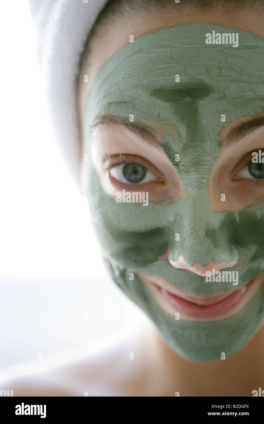 Young happy woman wearing facial mask Stock Photo - Alamy