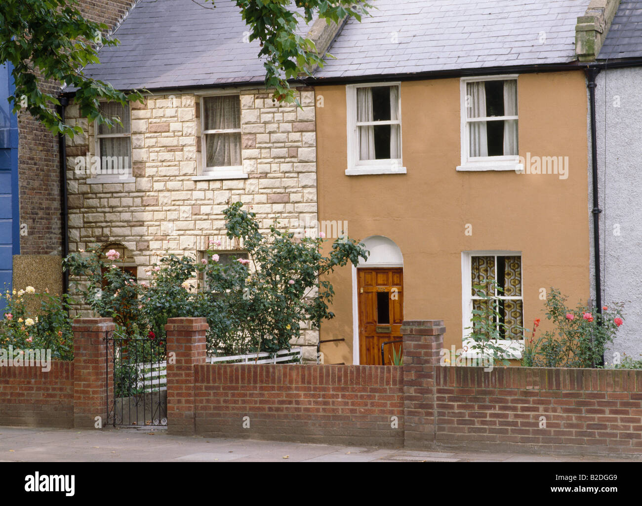 Well painted terraced cottage and cottage with stone cladding Stock ...