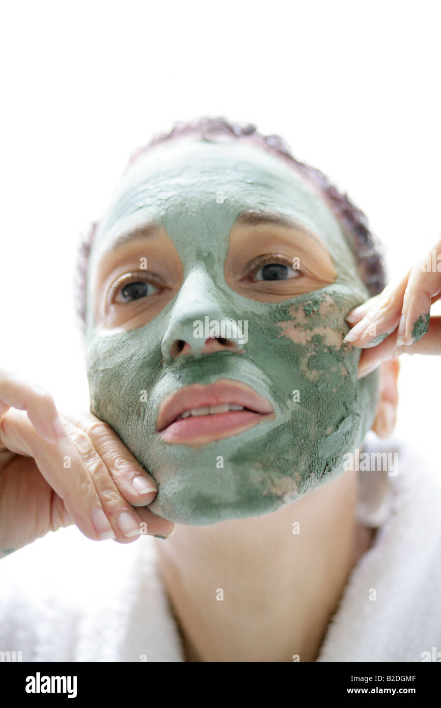 Woman with face mask peel off hi-res stock photography and images - Alamy