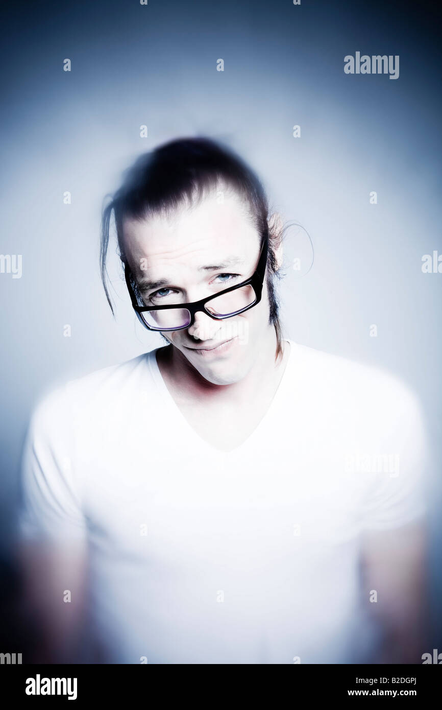 studio shot portrait of young expressive man making faces Stock Photo ...