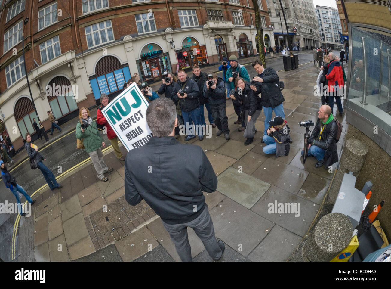 Photographers picture NUJ Gen Secretary Jeremy Dear holding poster ...