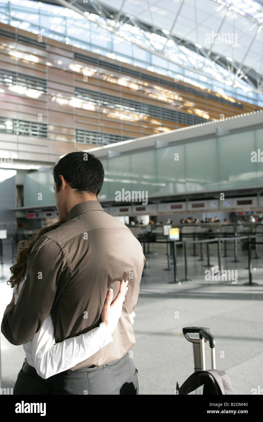 Two women hug airport hi-res stock photography and images - Alamy
