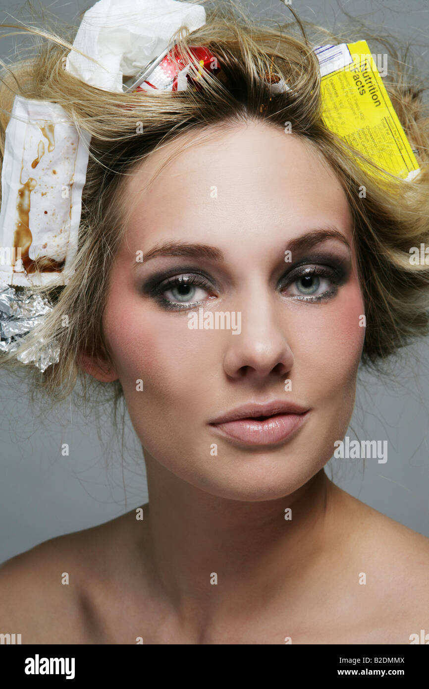 Young woman with trash in hair Stock Photo - Alamy