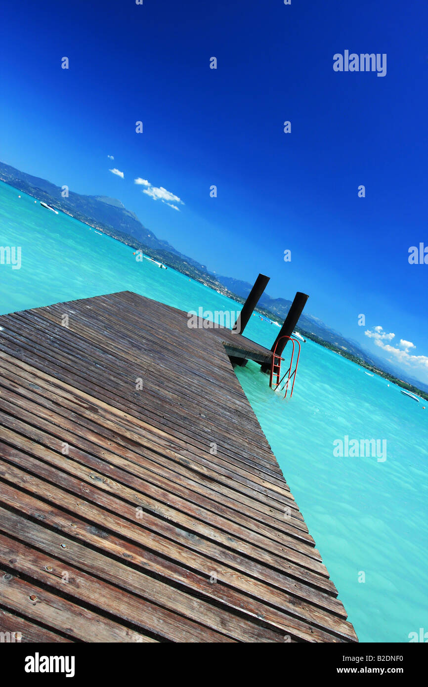 Small jetty leading out into incredible green water and blue sky taken ...