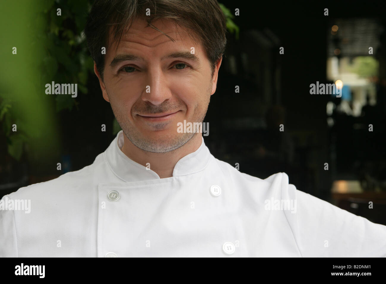 Portrait of male chef outdoors Stock Photo - Alamy