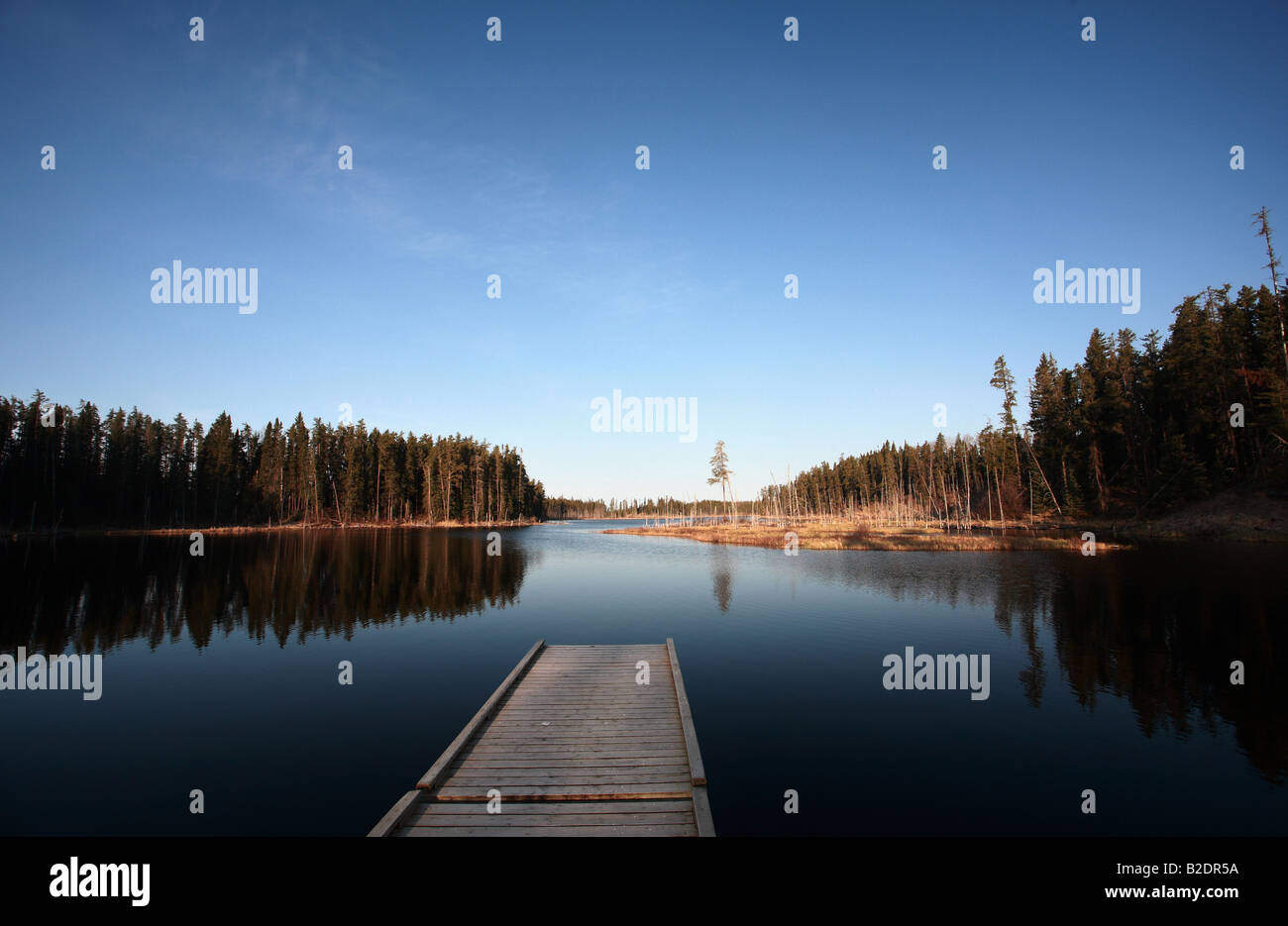 Dock on Northern Manitoba lake Stock Photo - Alamy