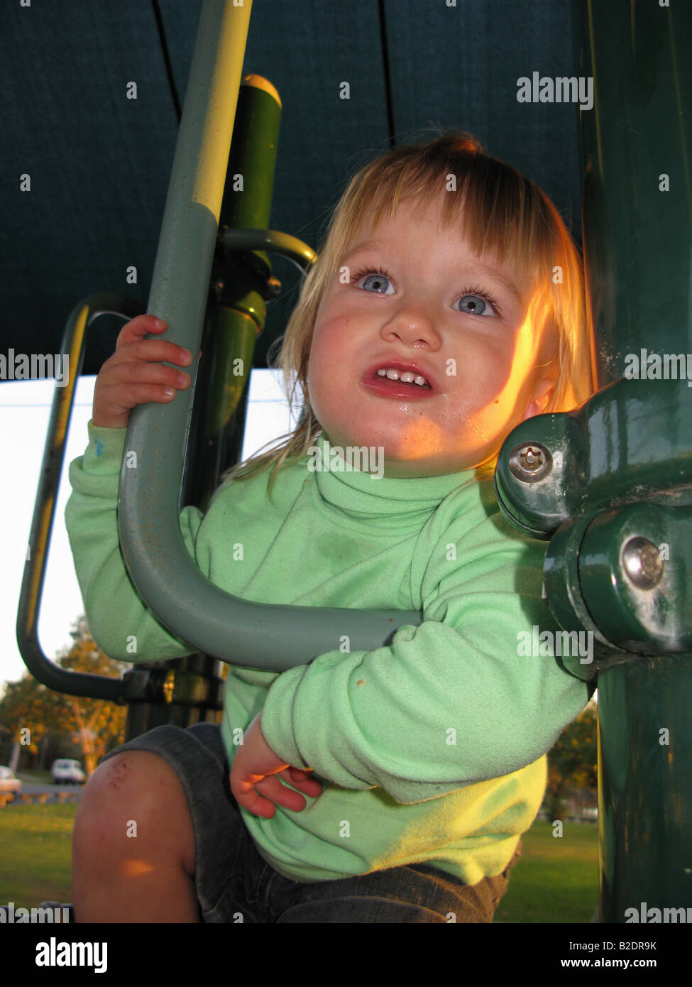 Portrait of toddler in playground Stock Photo - Alamy