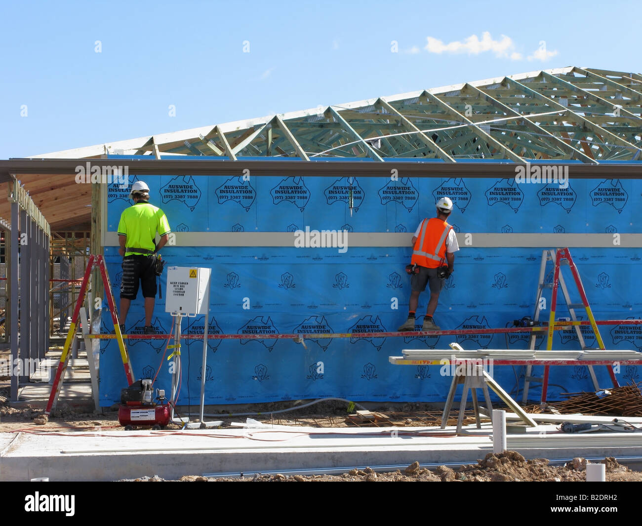 Australian workers building a house Stock Photo - Alamy