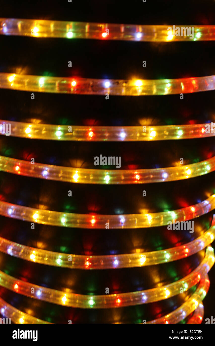 tree covered with bright tube lights at night Stock Photo - Alamy