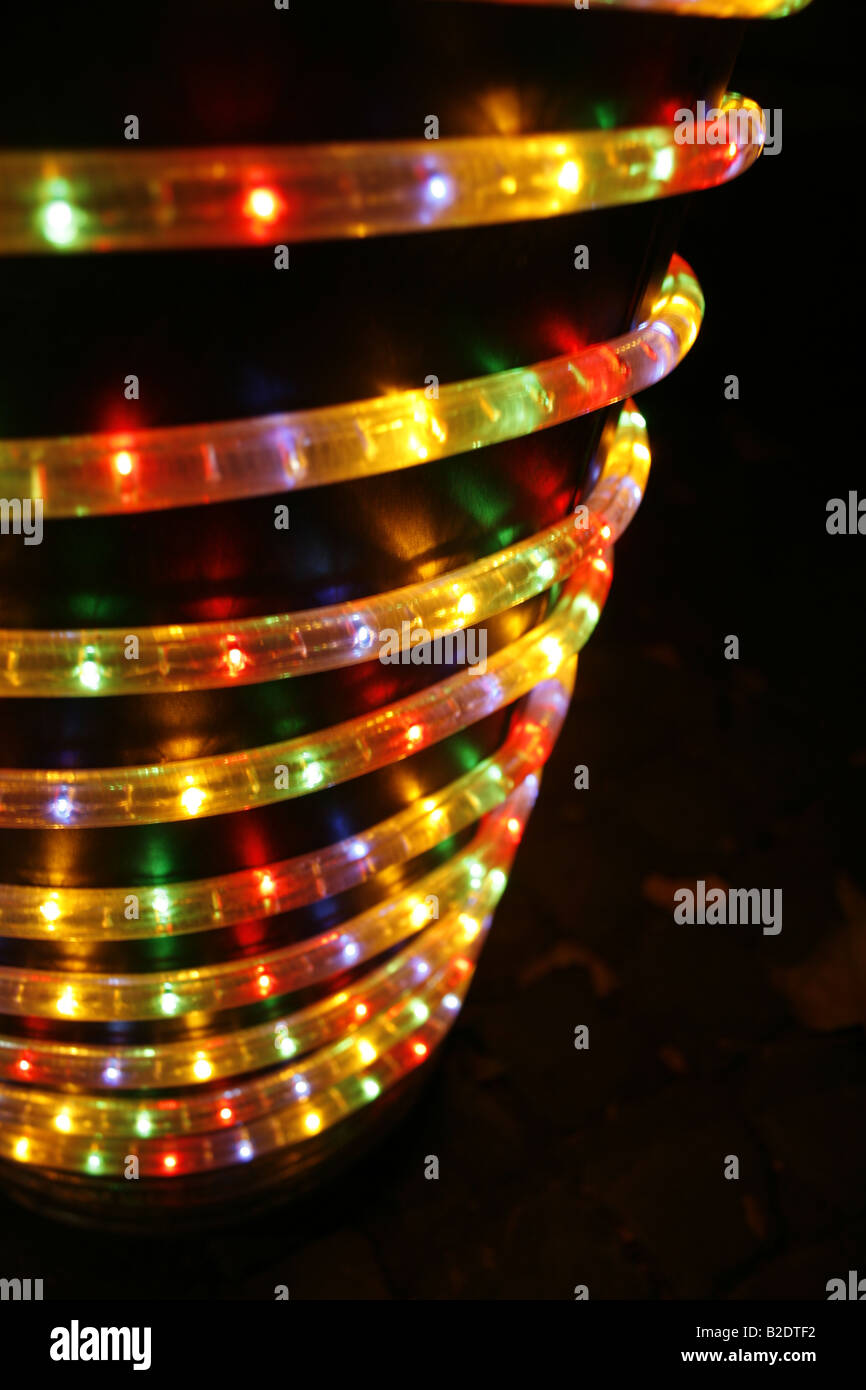 tree covered with bright tube lights at night Stock Photo - Alamy